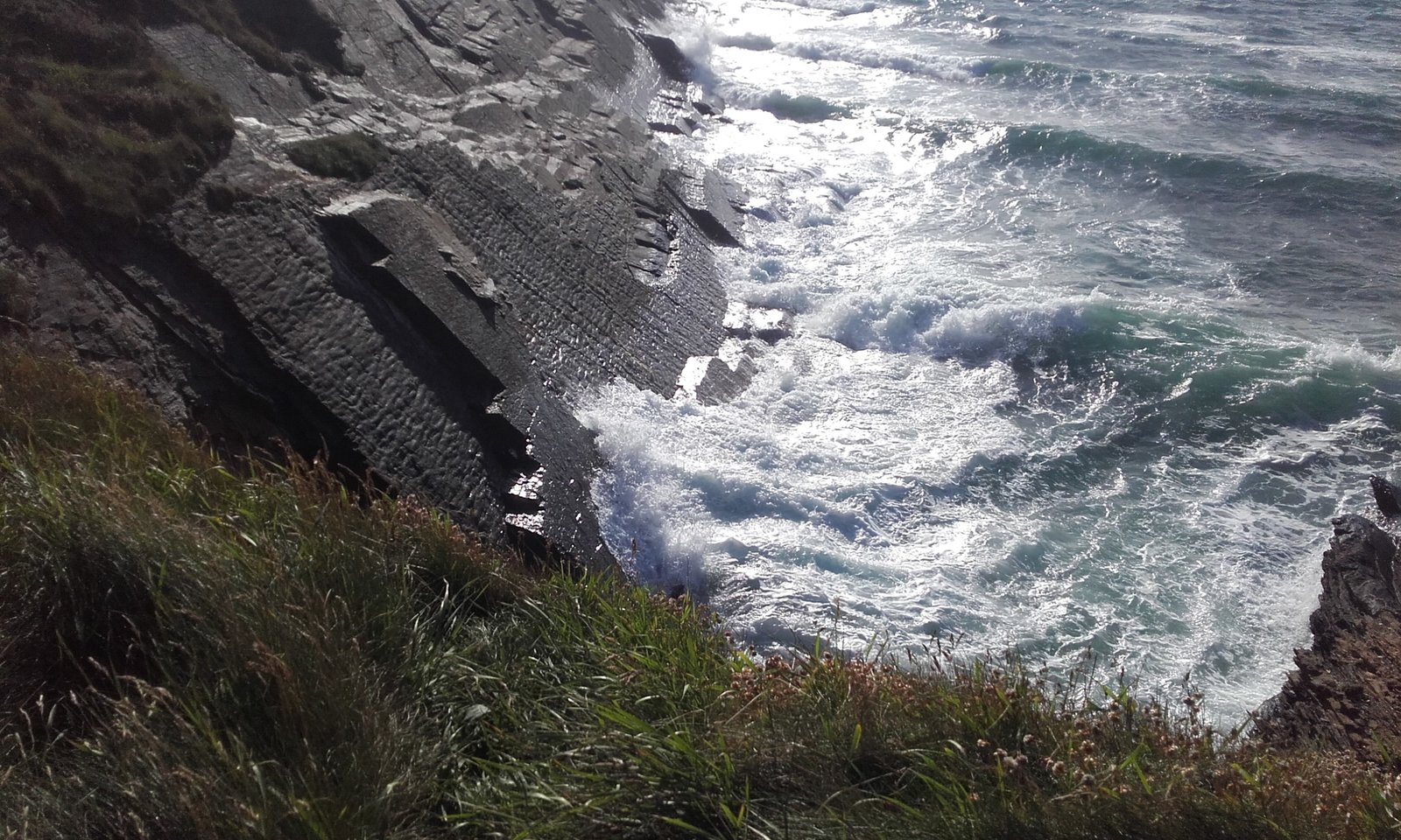 Wave smashing against 'seal's cave'. - Member Collections - The Fossil ...