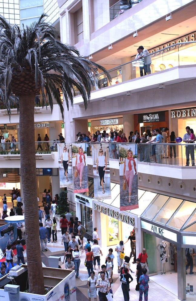 Palm trees indoors at Raffles City Mall. Adjacent to the colonial ...