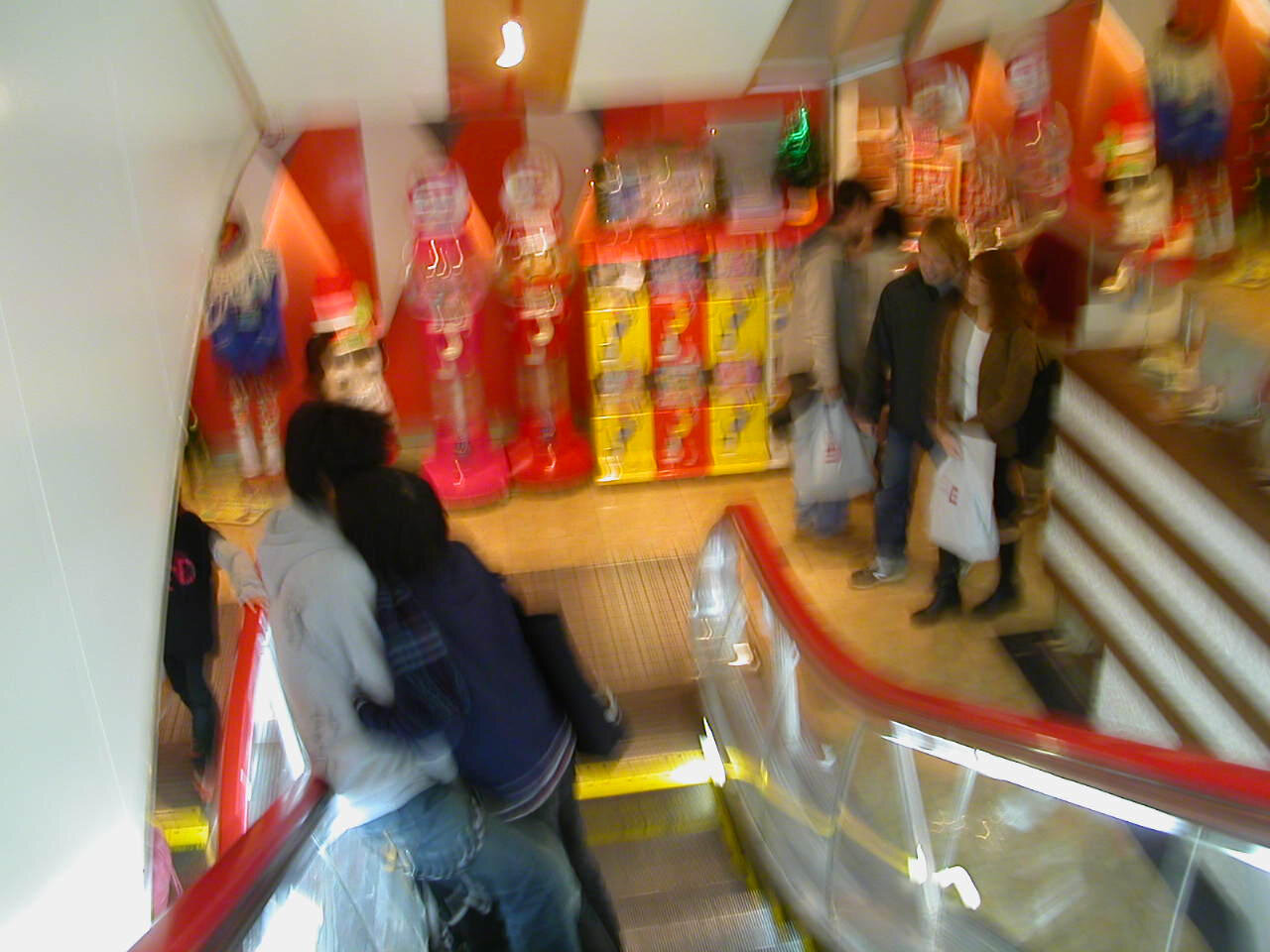 Inside a Tokyo shopping centre, the bright colours and neon delirium of ...