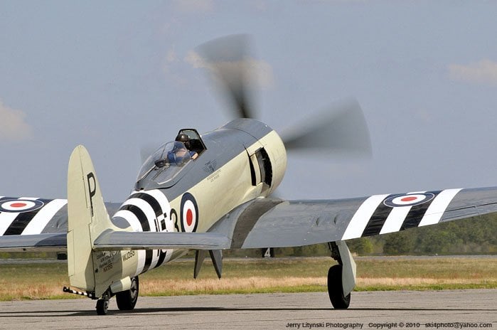 A World War II-era Hawker Sea Fury fighter on the taxiway ...