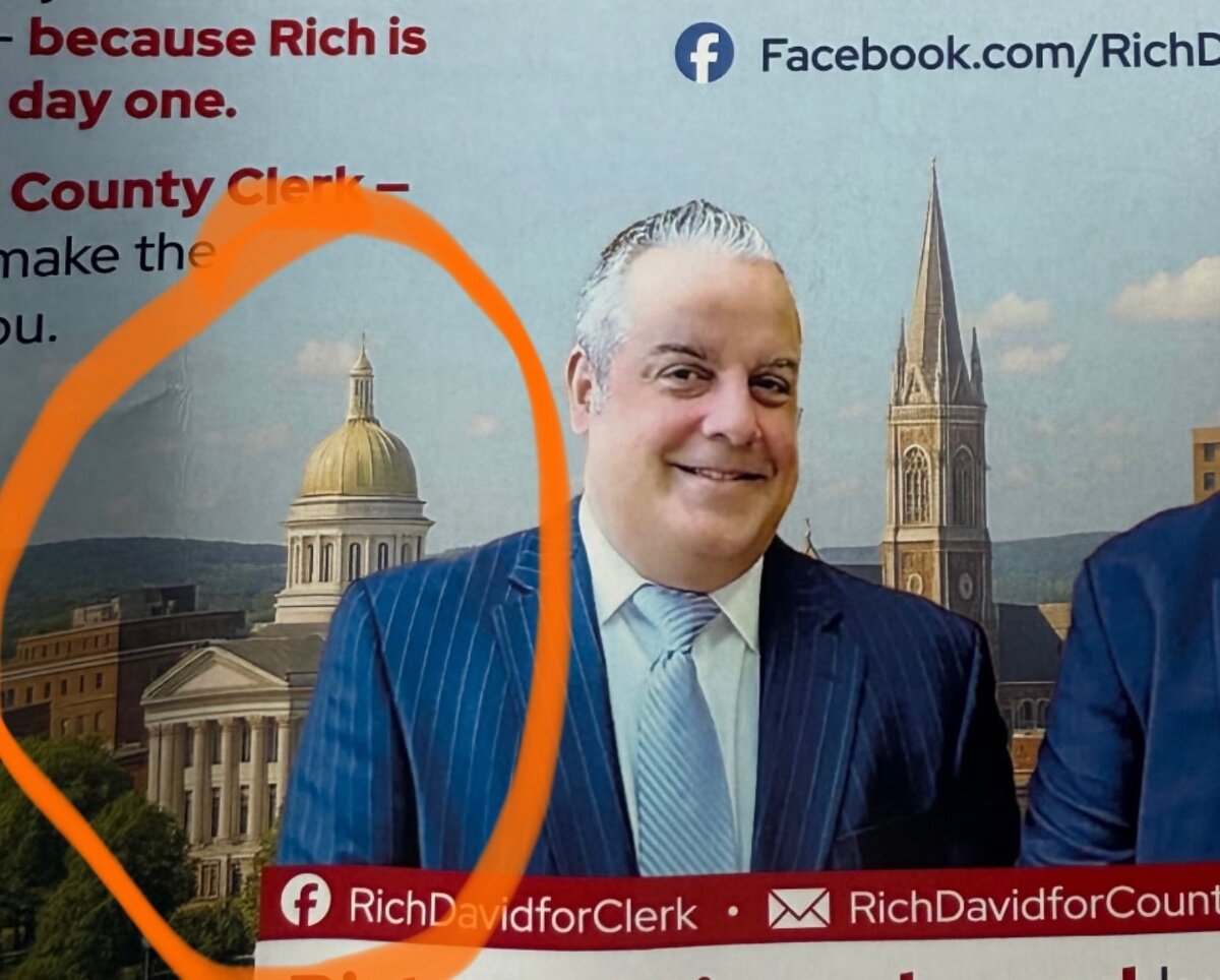 Is Rich David running in some other county? His mail piece features ...