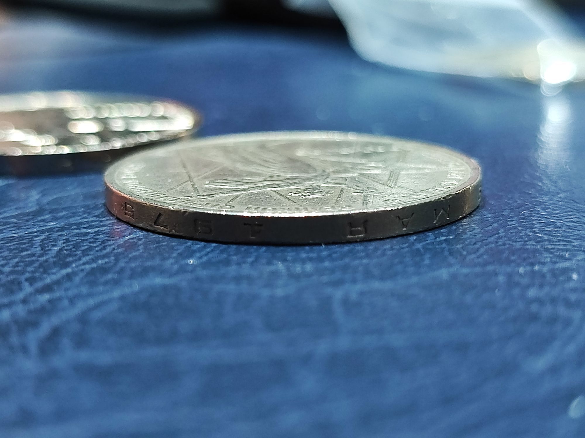 A question about the order of lettering on the edge of same coins ...