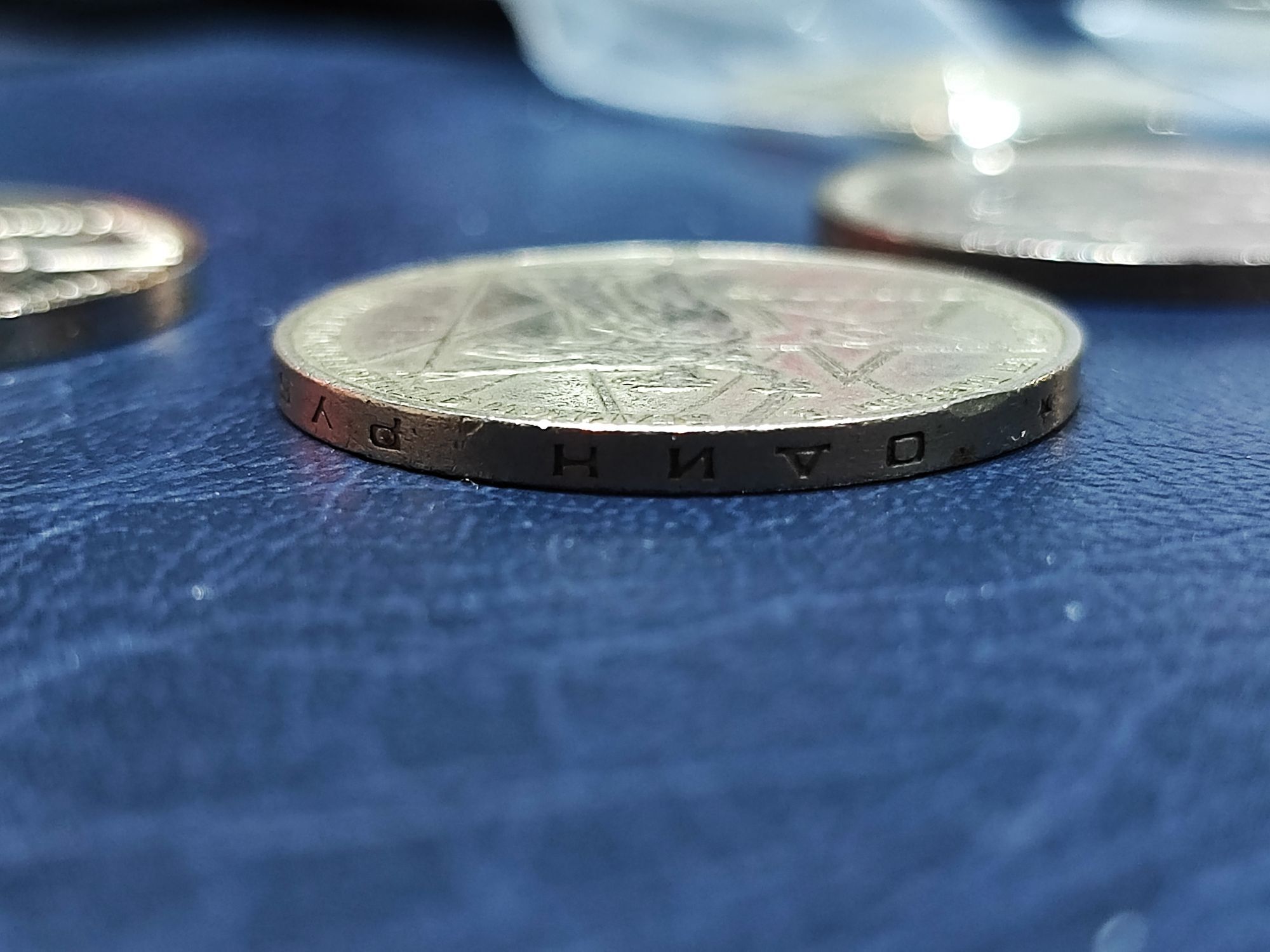 A question about the order of lettering on the edge of same coins ...