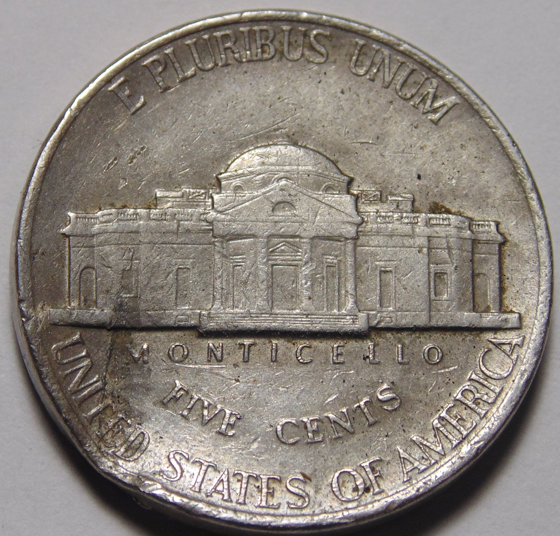 What happened to this coin? Can you recognize what is or is not damage ...