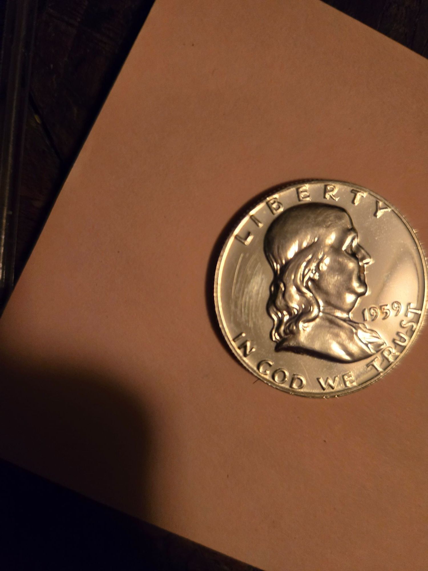 While labels with a green border that says International Numismatic ...