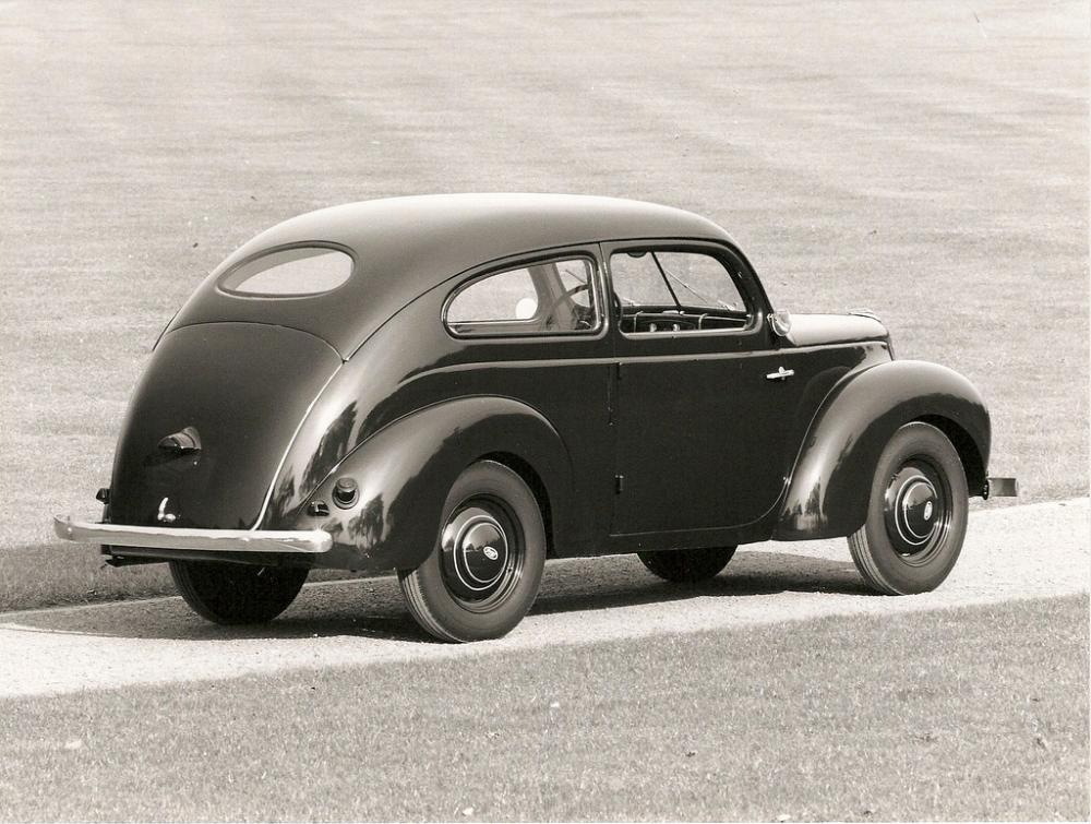 What is the car in the right background with the oval rear window ...