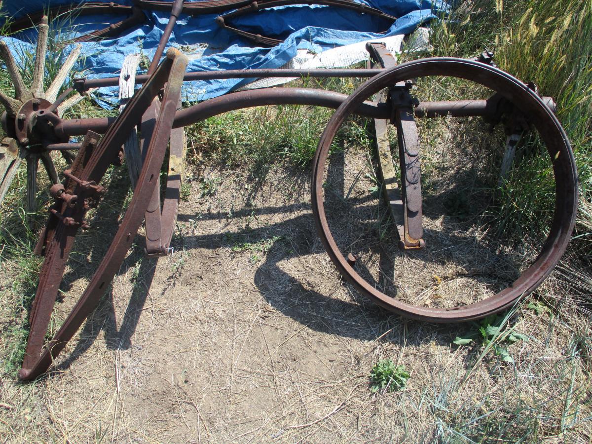 Tube front axle with drop,had 25" woodspoke wheels,non-descript steel ...