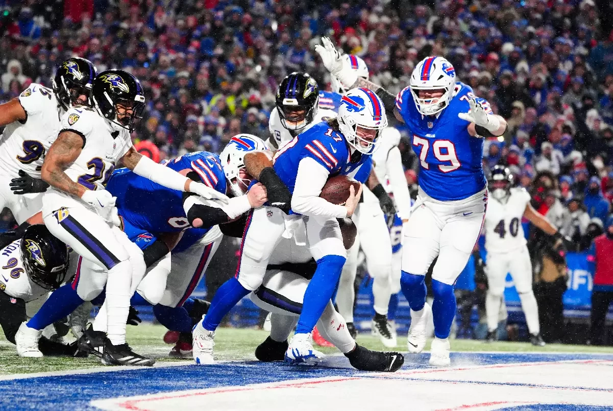 Josh Allen, getting his tush pushed as he breaks through the line for ...