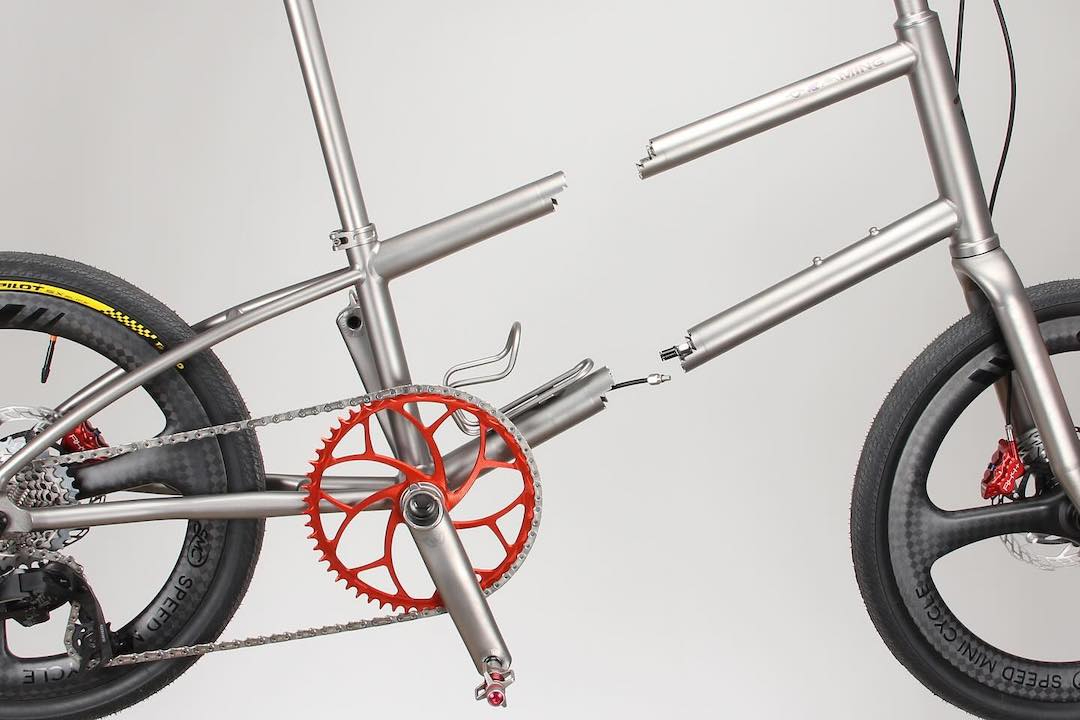 This titanium mini-bike is designed to fit inside a RIMOWA suitcase ...