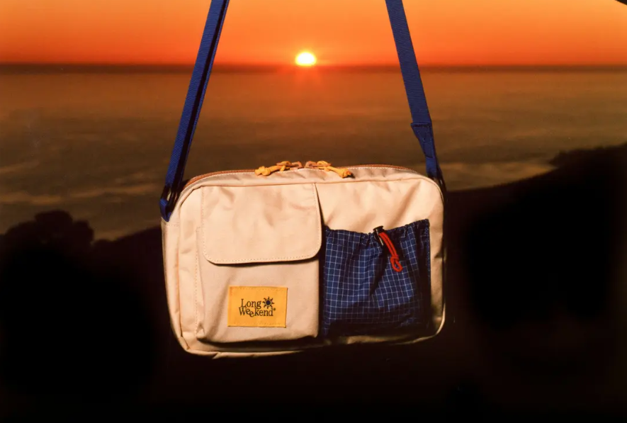 This compact shoulder bag blends clean design with practical ...